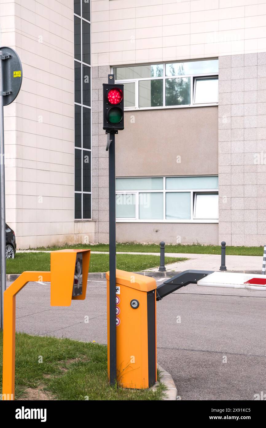 Barrier system with traffic light in the parking lot of public building Stock Photo - Alamy