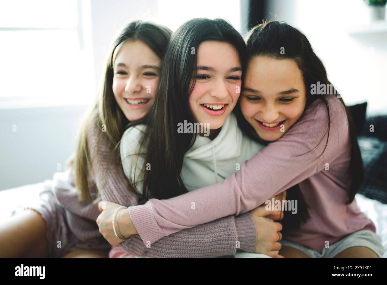 Three excited teenager girls having fun together, enjoying laze leisure ...