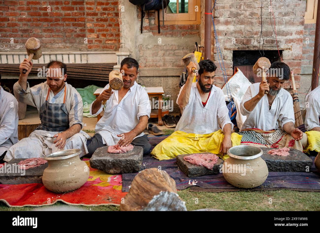 Traditional Kashmiri chefs smash lamb meat to prepare a dish called ...