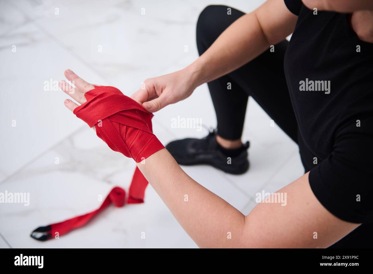 Top view of an Caucasian boxer fighter woman in black sports wear ...