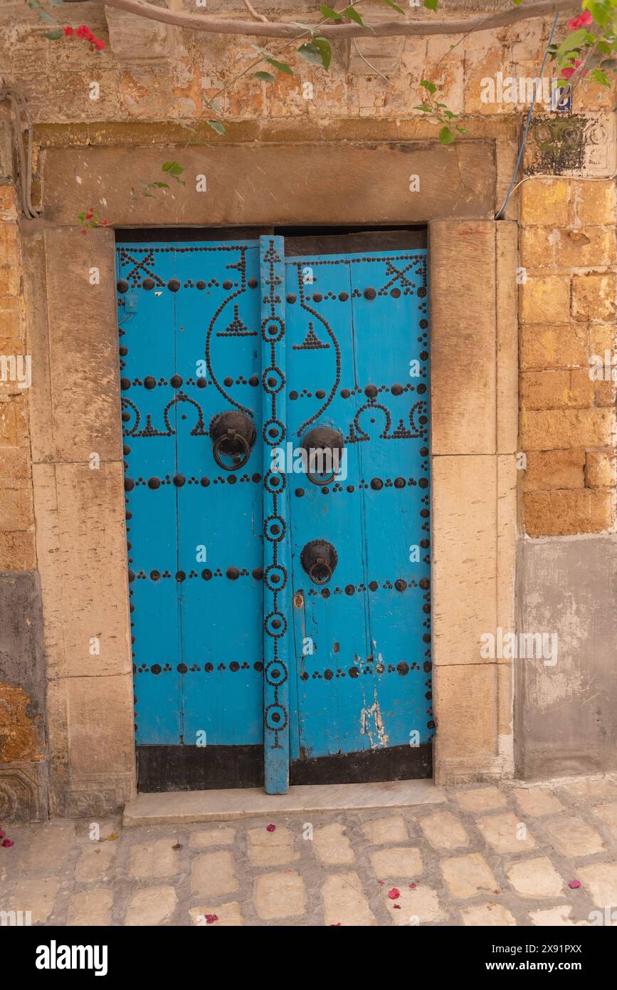 A blue wooden door, traditional local architecture in the Medina of ...