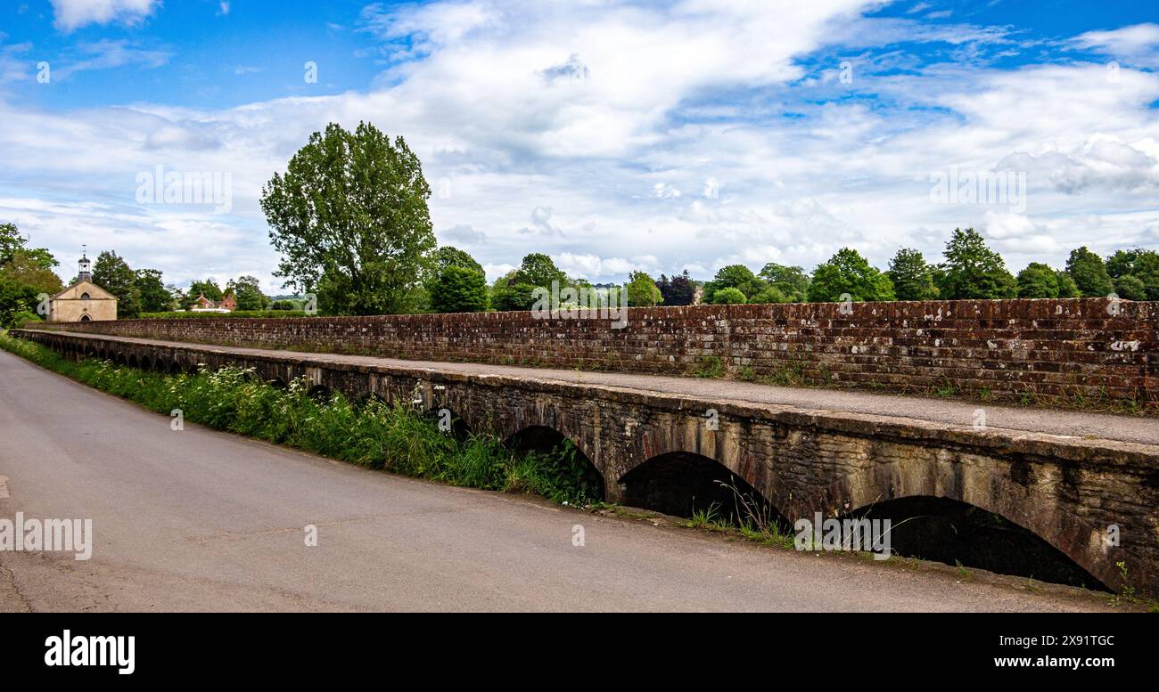 Old stone raised arched causeway to keep pedestrians dry when the river ...