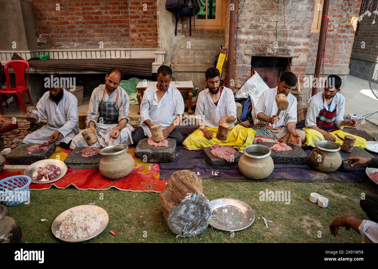 Traditional Kashmiri chefs smash lamb meat to prepare a dish called ...
