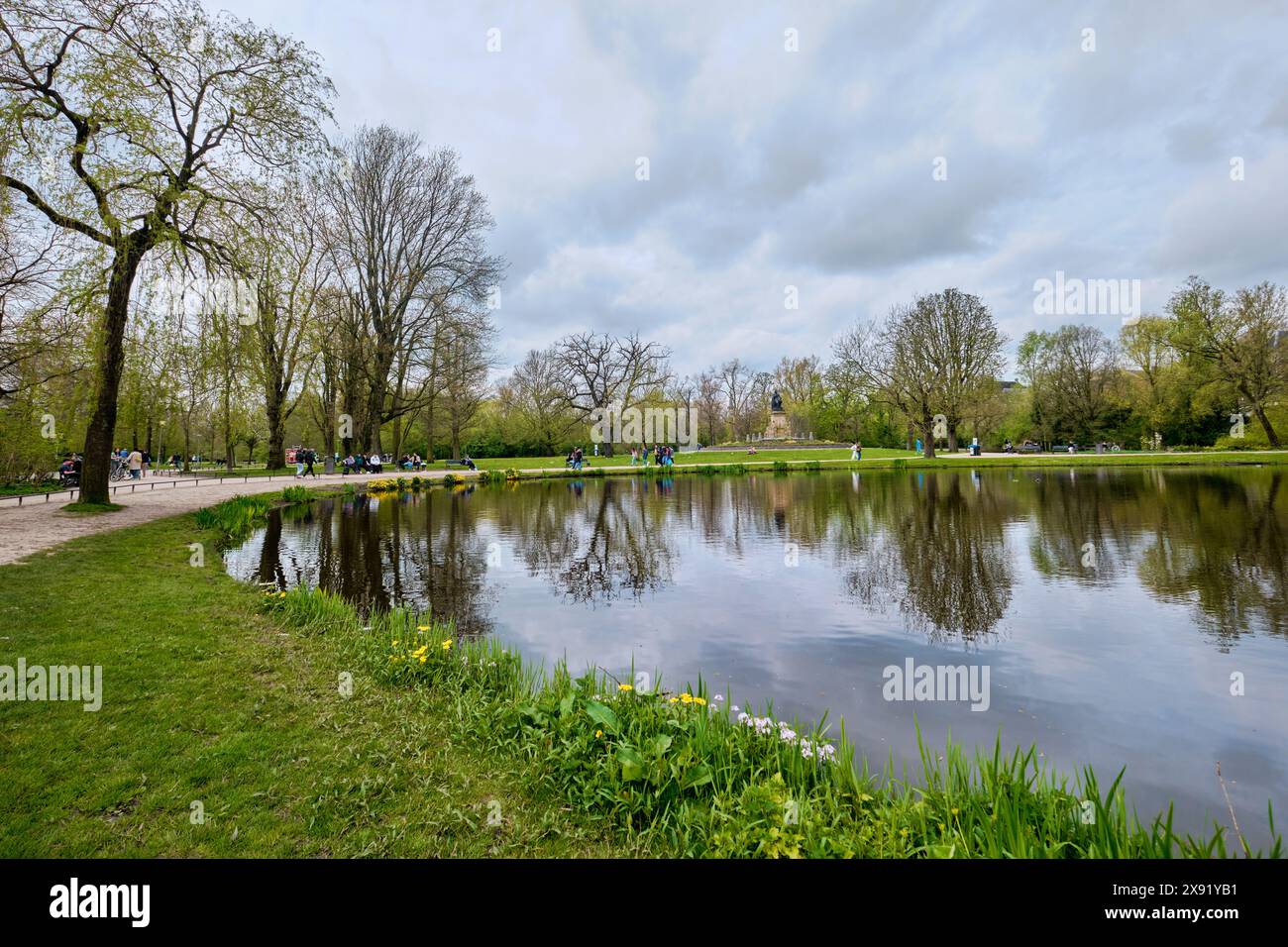 Netherlands, Amsterdam - April 10, 2024: Grass field and pond at ...