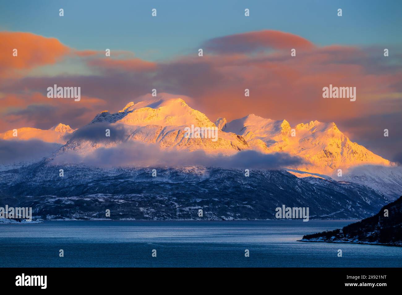 The magical light of the ending polar day on the snowy hills of Lofoten ...