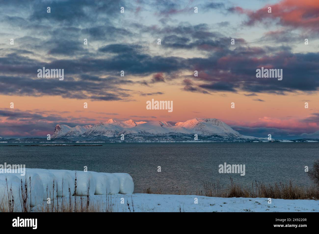The magical light of the ending polar day on the snowy hills of Lofoten ...