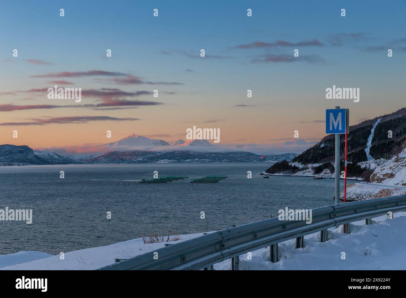 The magical light of the ending polar day on the snowy hills of Lofoten ...