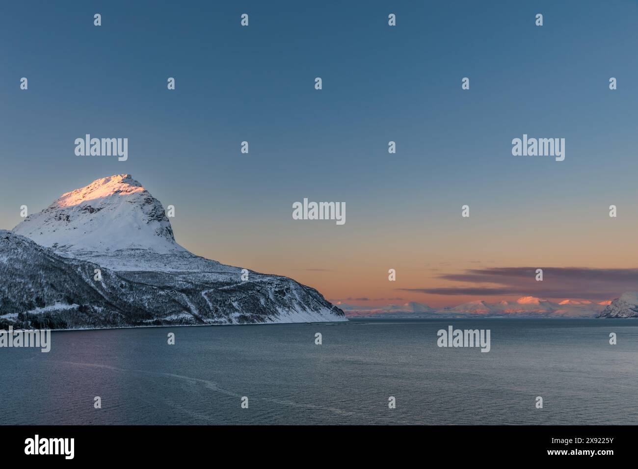 The magical light of the ending polar day on the snowy hills of Lofoten ...