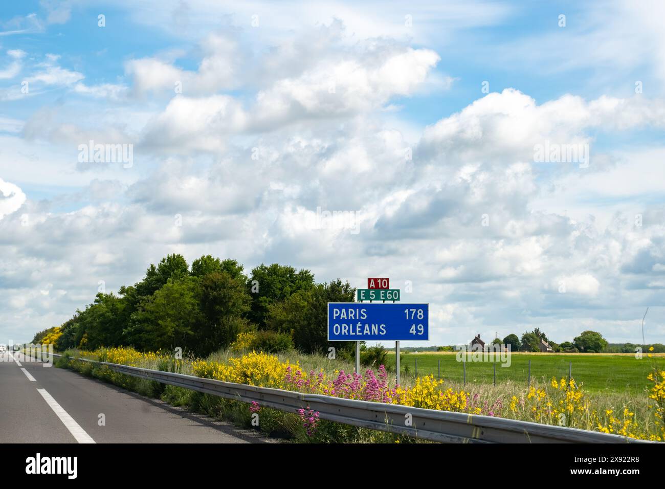Driving in summer on highway and road signs direction to Paris and ...