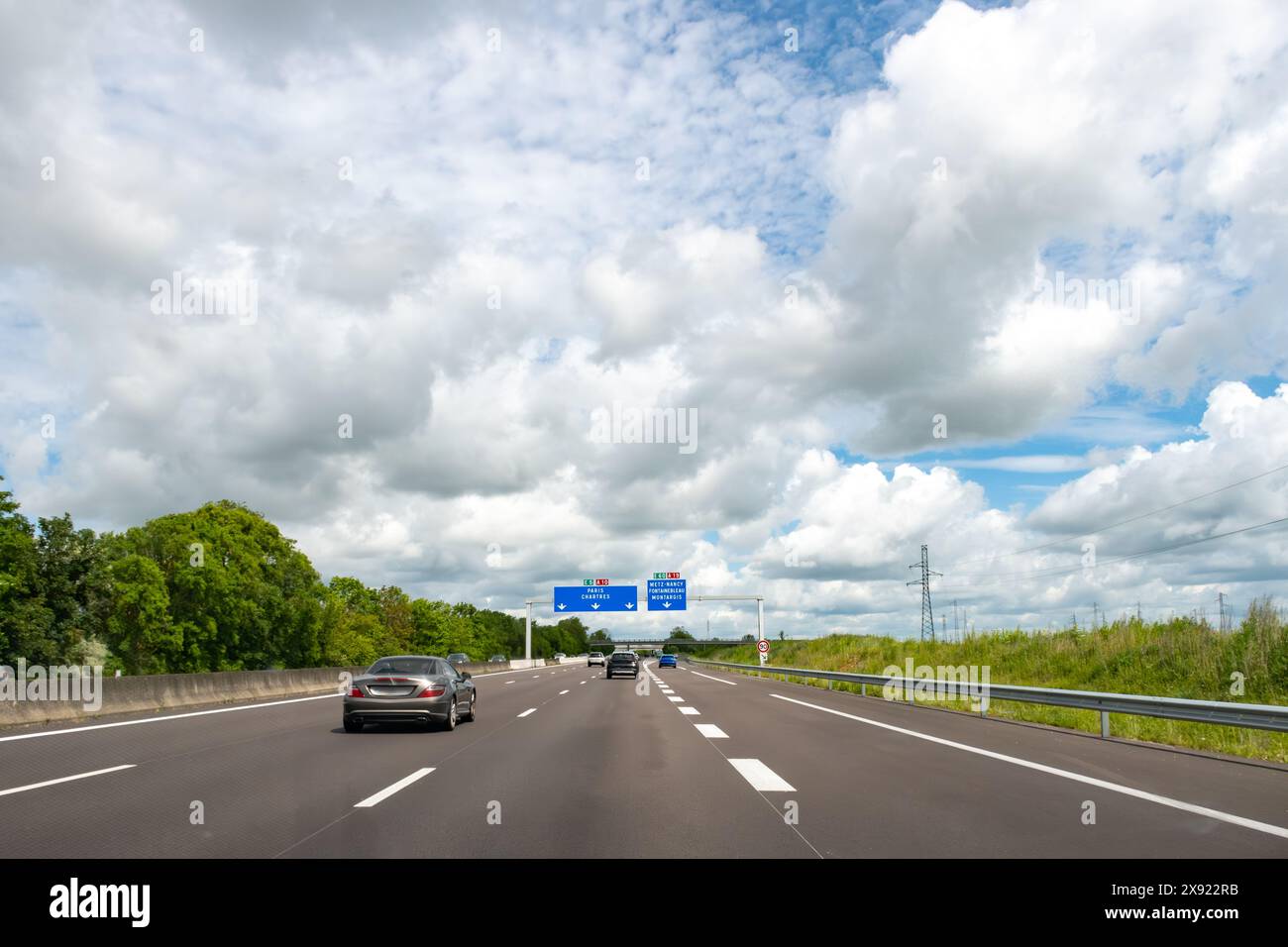 Driving in summer on highway and road signs direction to Paris and ...
