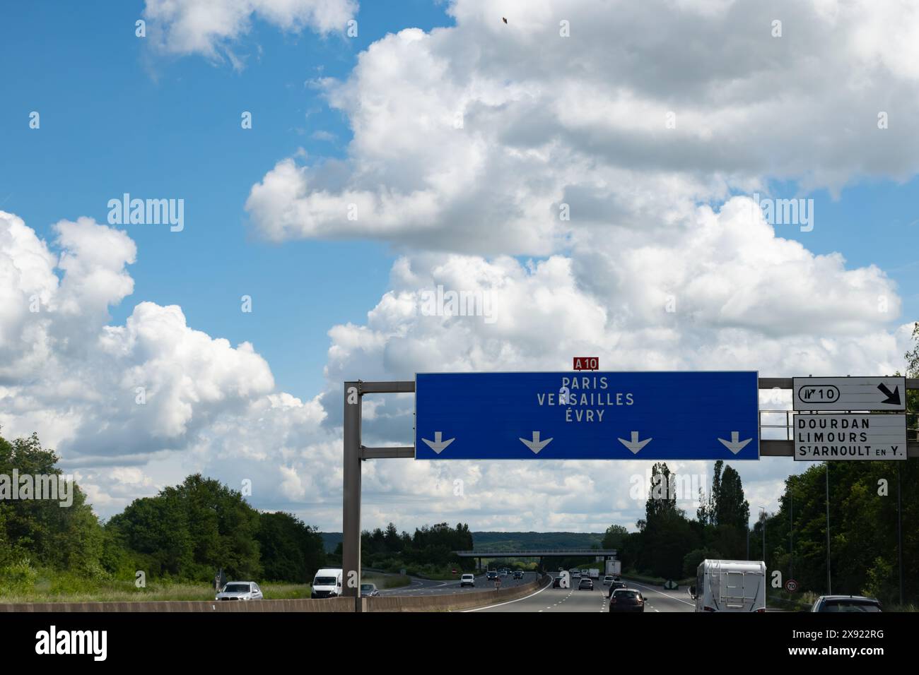 Driving in summer on highway and road signs direction to Paris and ...