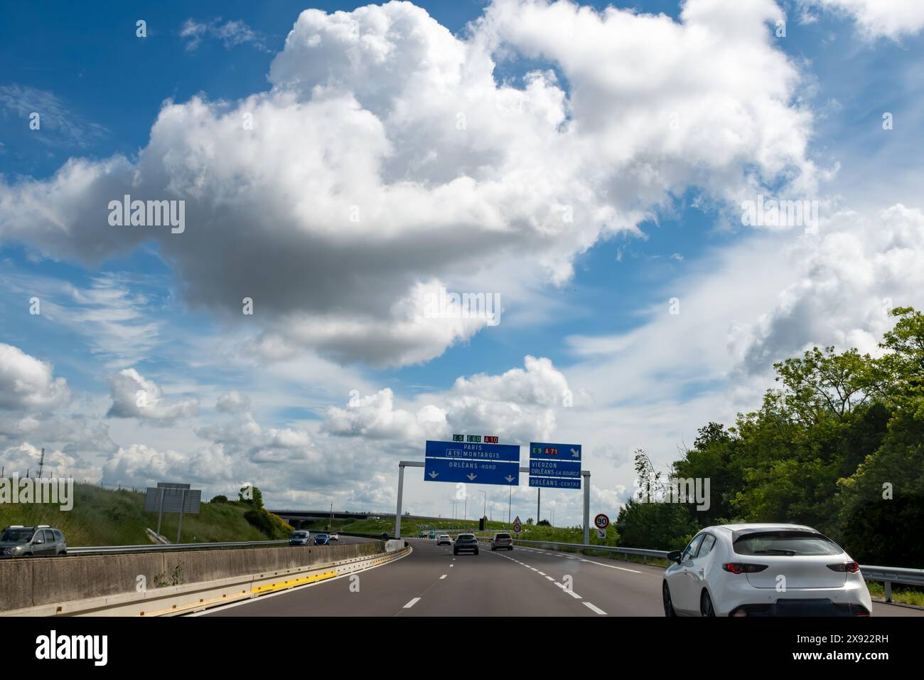 Driving in summer on highway and road signs direction to Paris and ...