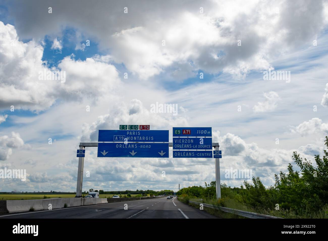 Driving in summer on highway and road signs direction to Paris and ...
