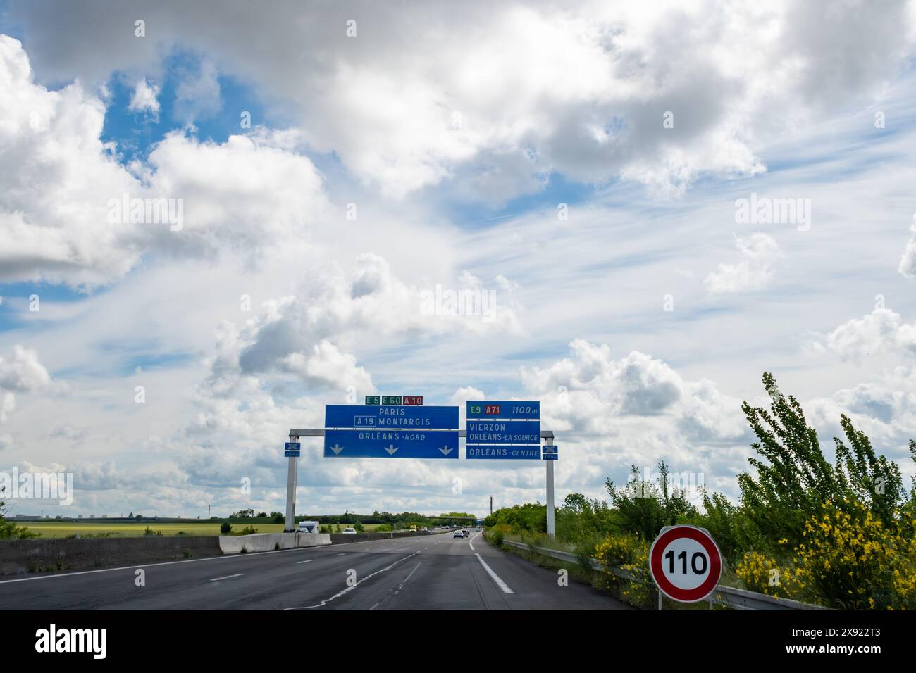 Driving in summer on highway and road signs direction to Paris and ...