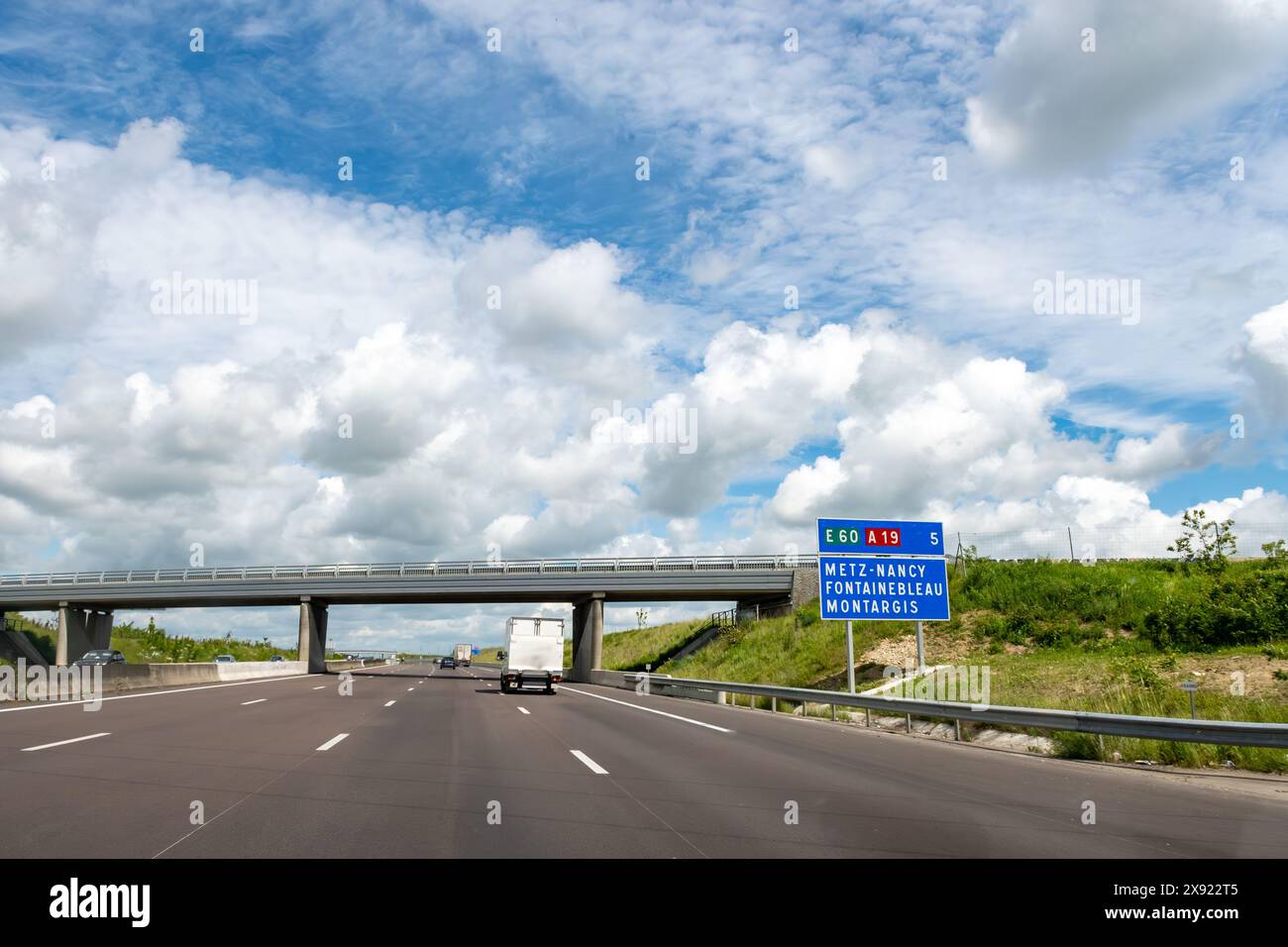 Driving in summer on highway and road signs direction to Paris and ...