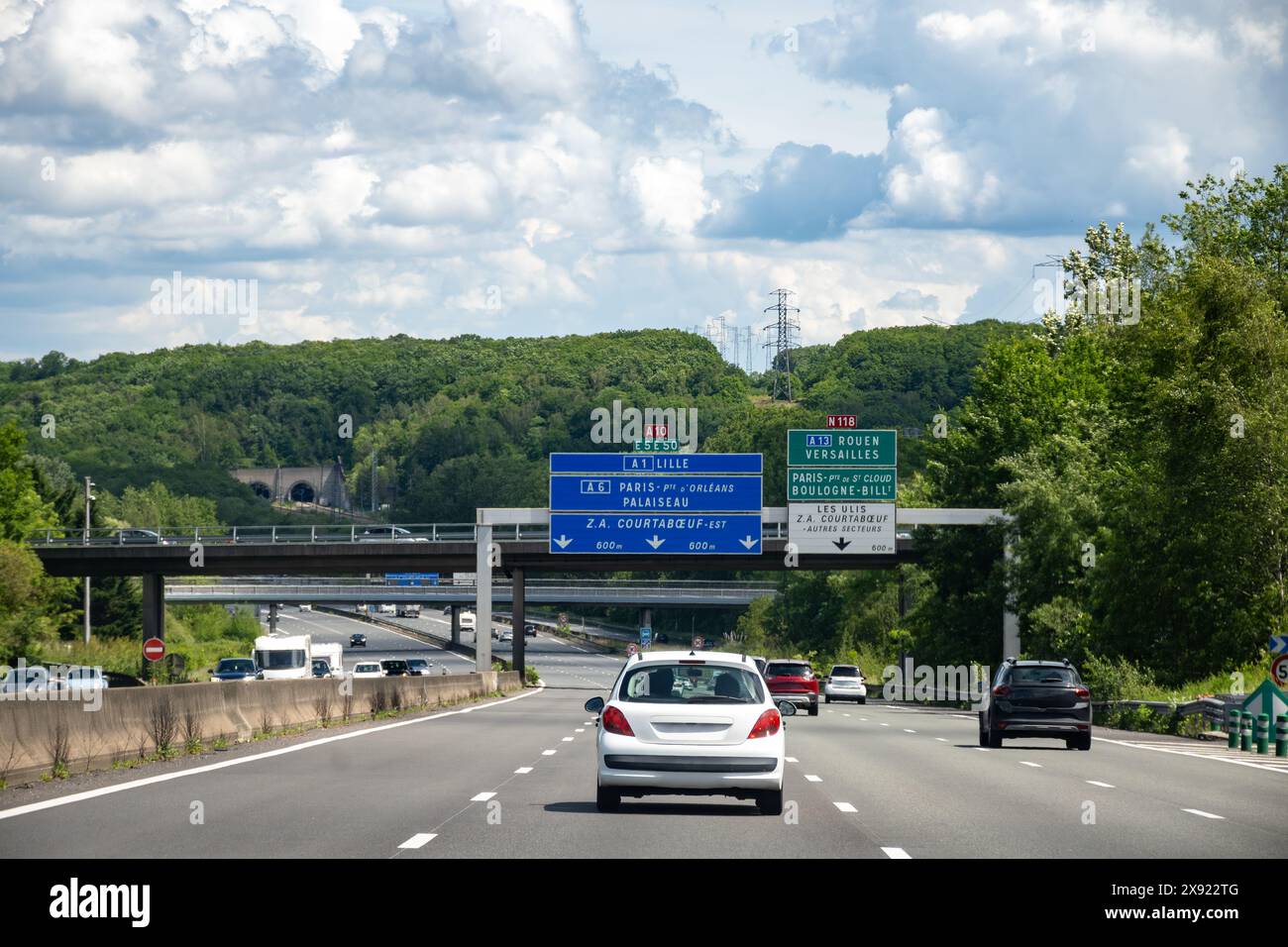 Driving in summer on highway and road signs direction to Paris and ...