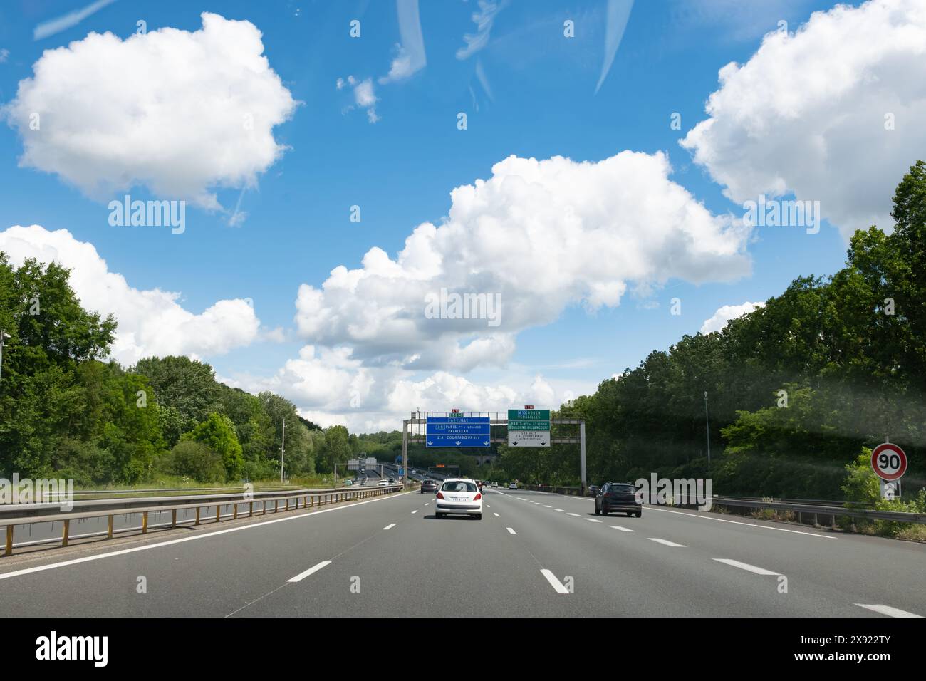 Driving in summer on highway and road signs direction to Paris and ...