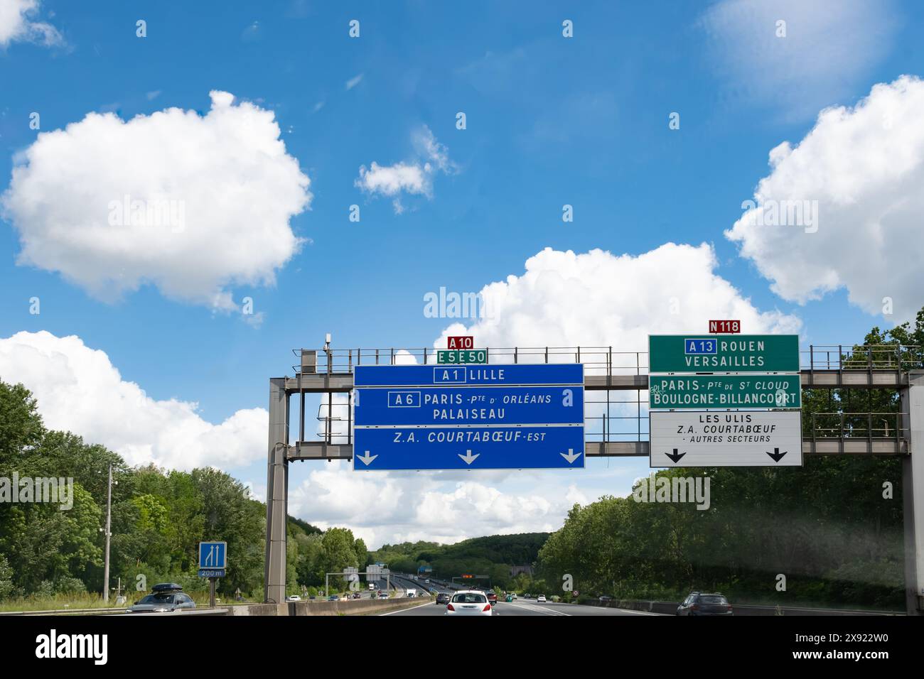 Driving in summer on highway and road signs direction to Paris and ...