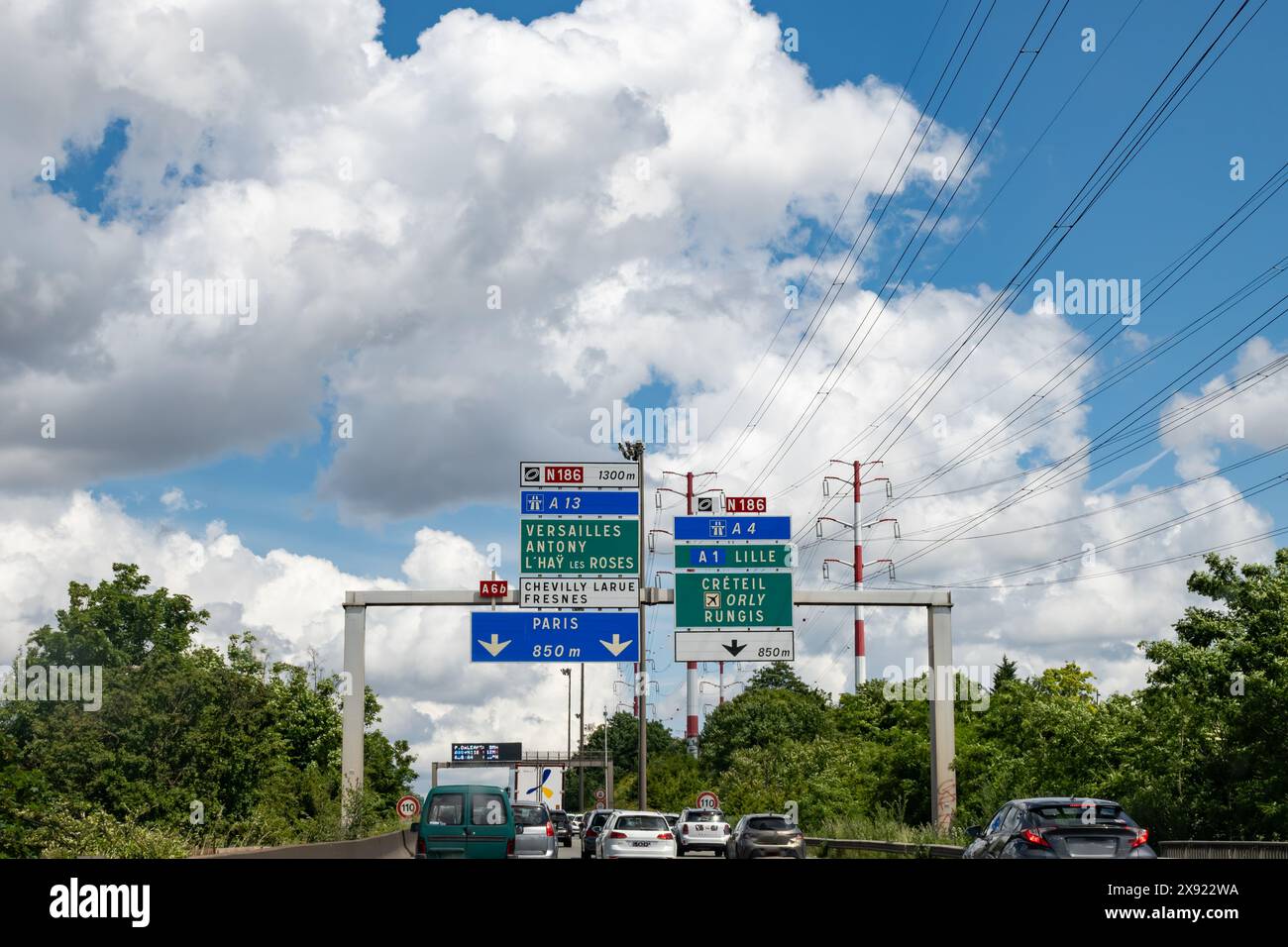 Driving in summer on highway and road signs direction to Paris and ...