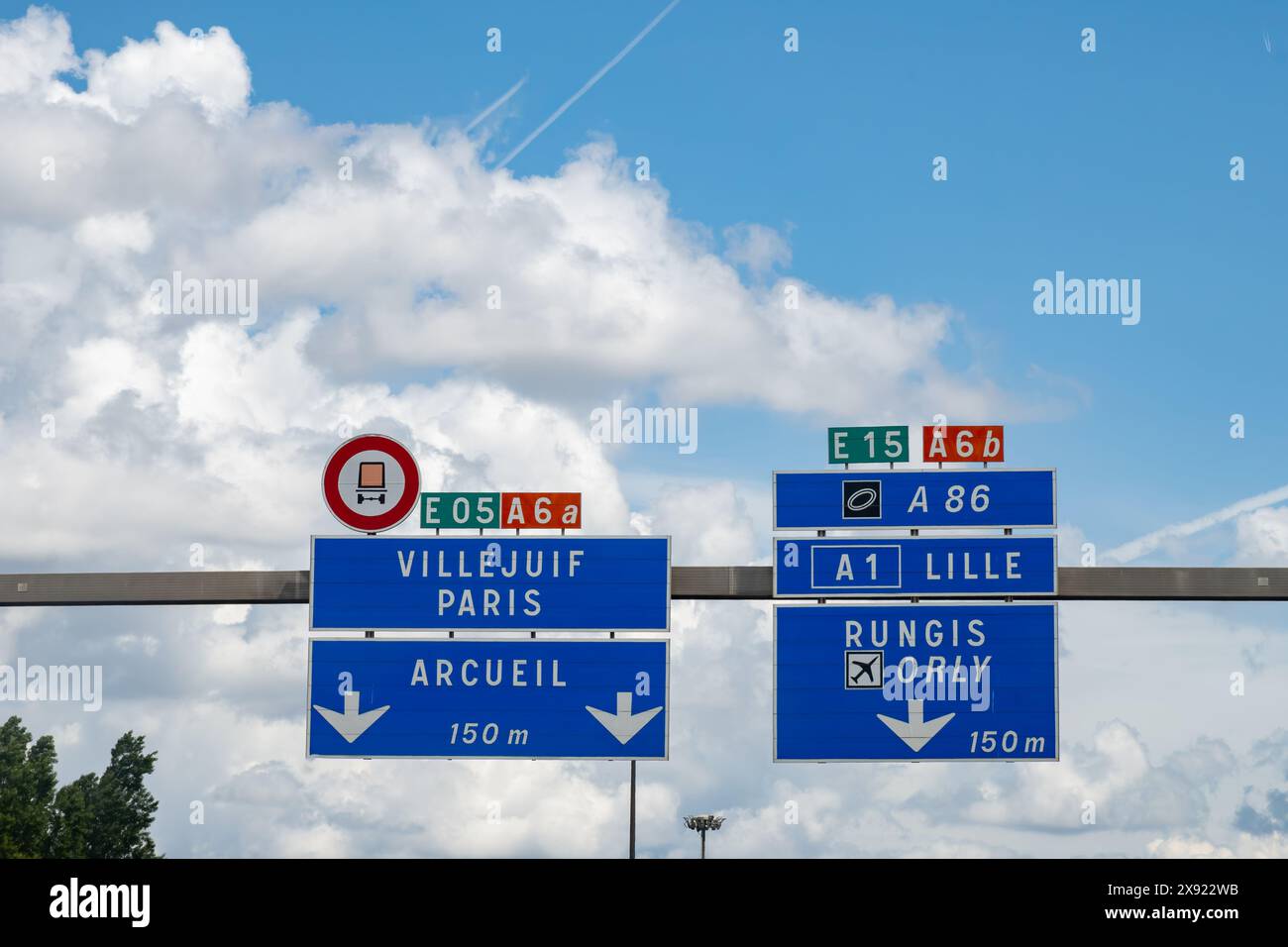 Driving in summer on highway and road signs direction to Paris and ...