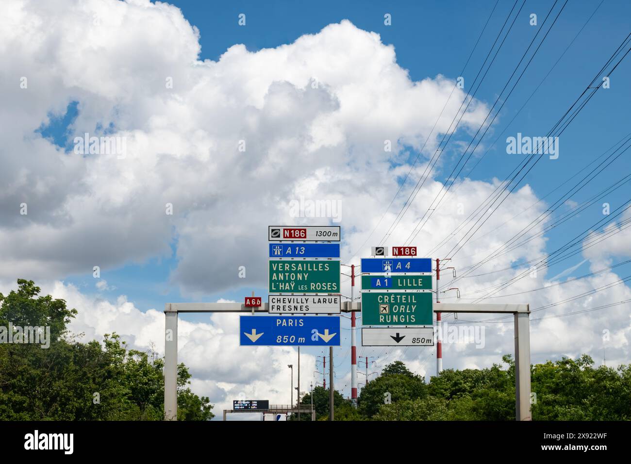 Driving in summer on highway and road signs direction to Paris and ...