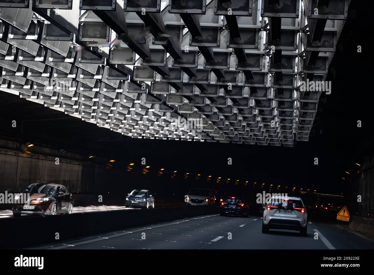 Driving in heavy summer traffic on ring road of capital of France ...
