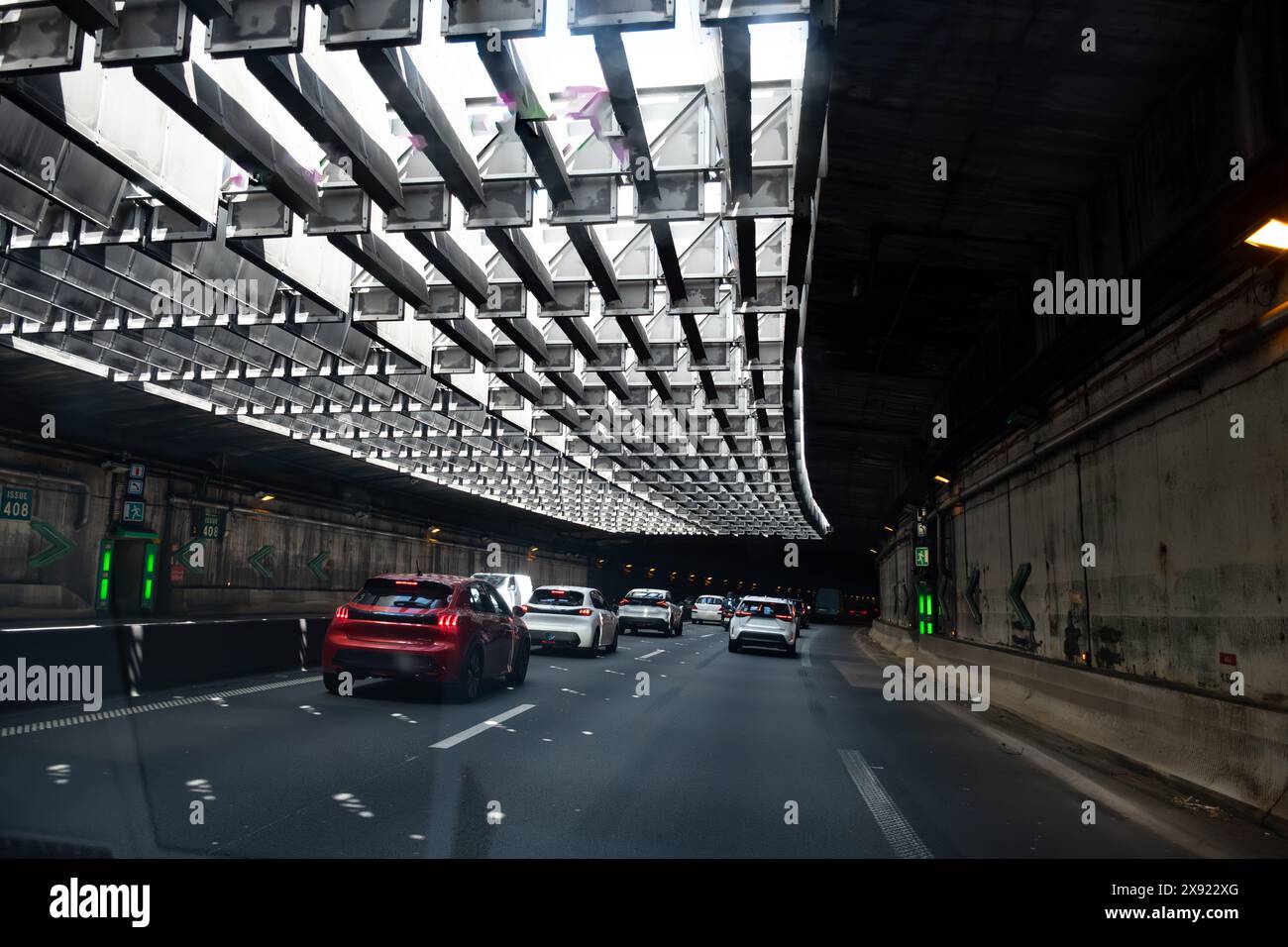 Driving in heavy summer traffic on ring road of capital of France ...