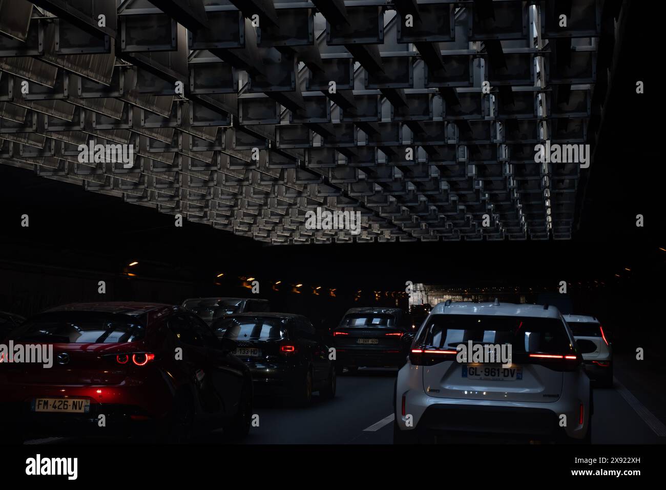 Driving in heavy summer traffic on ring road of capital of France ...