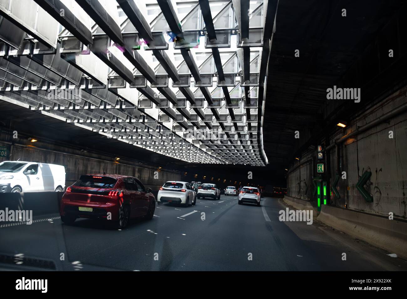 Driving in heavy summer traffic on ring road of capital of France ...