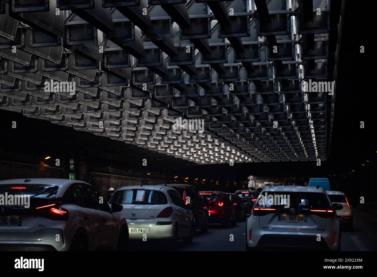 Driving in heavy summer traffic on ring road of capital of France ...