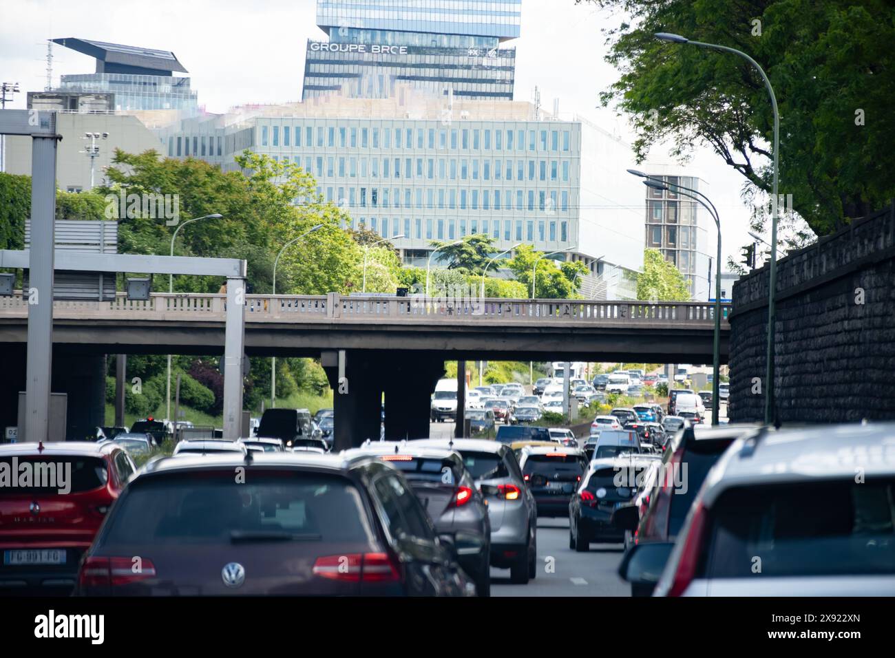 Driving in heavy summer traffic on ring road of capital of France ...