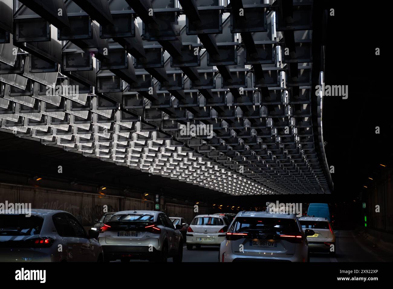 Driving in heavy summer traffic on ring road of capital of France ...