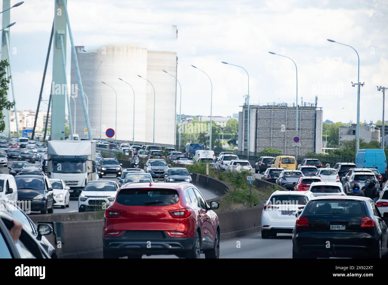 Driving in heavy summer traffic on ring road of capital of France ...