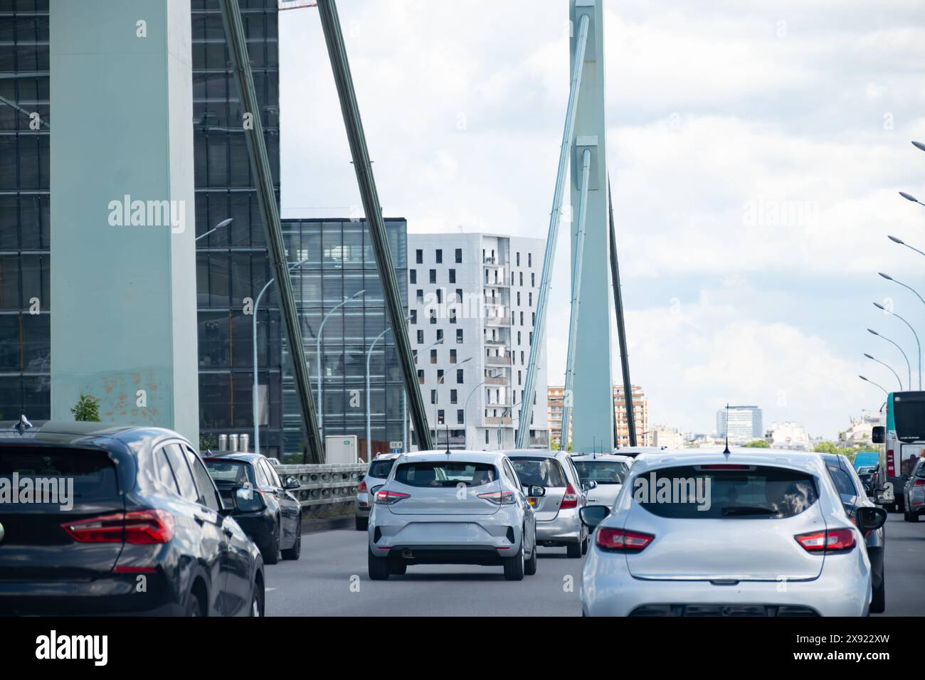 Driving in heavy summer traffic on ring road of capital of France ...
