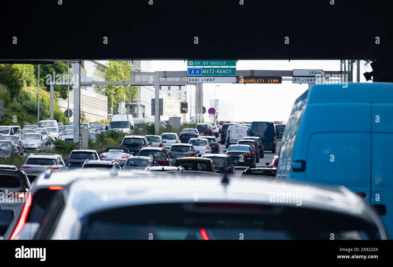 Driving in heavy summer traffic on ring road of capital of France ...