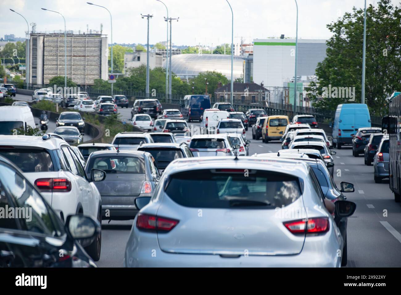 Driving in heavy summer traffic on ring road of capital of France ...