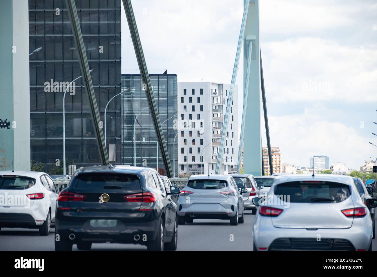 Driving in heavy summer traffic on ring road of capital of France ...