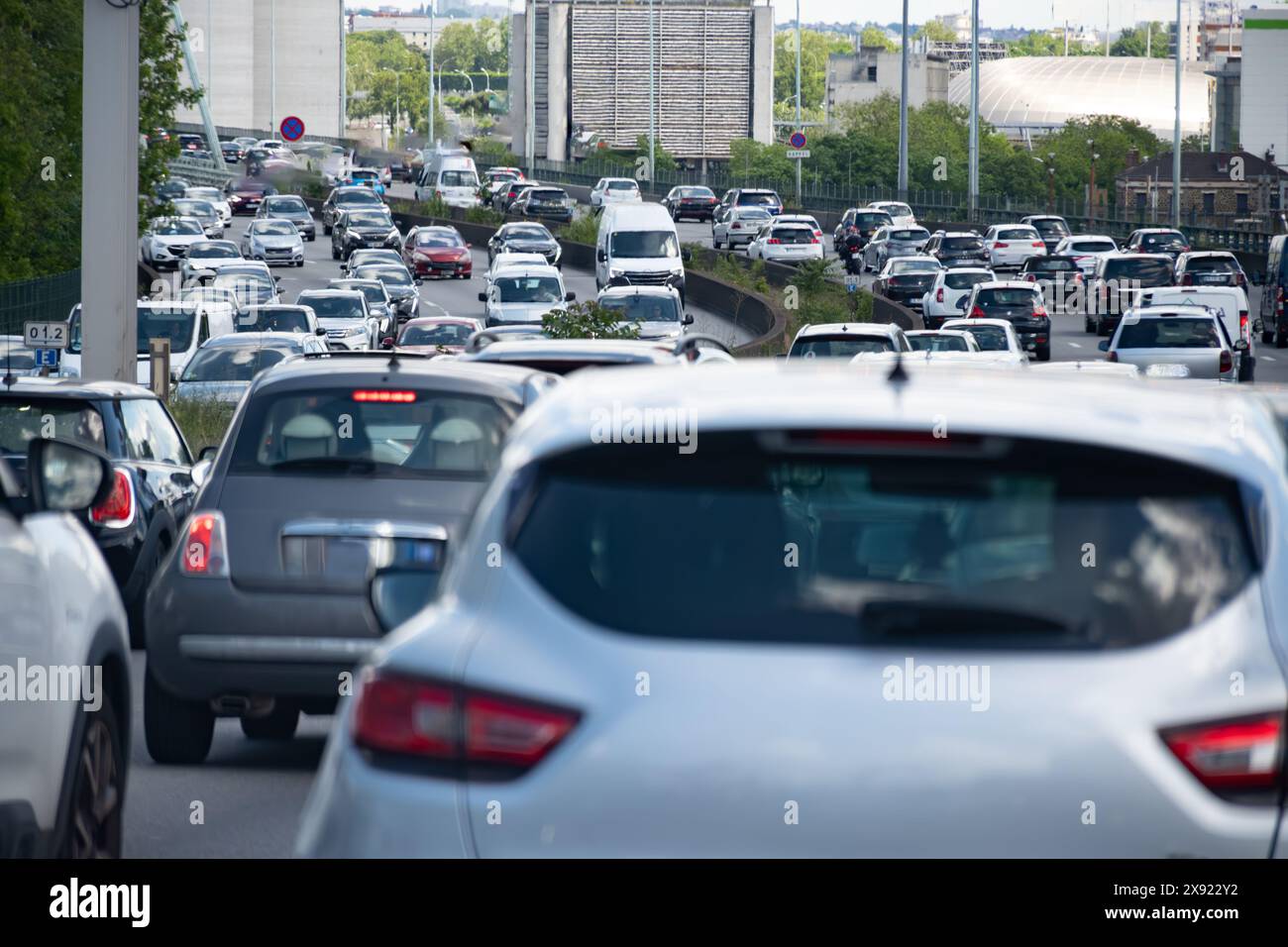 Driving in heavy summer traffic on ring road of capital of France ...
