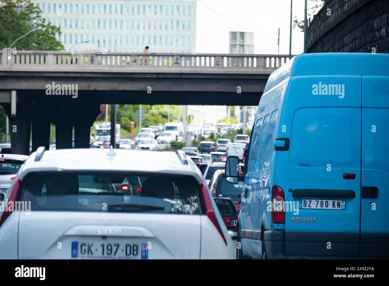 Driving in heavy summer traffic on ring road of capital of France ...