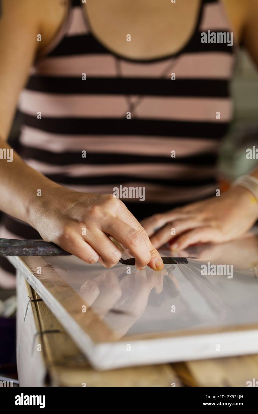 An in-depth look at a skilled female artist using professional tools to ...