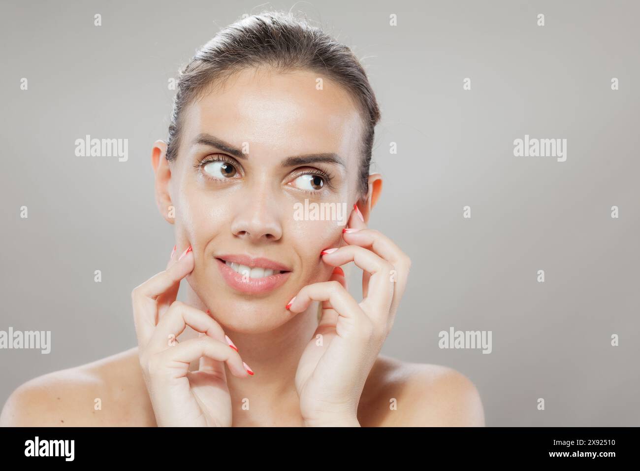 This high-resolution photo captures a young woman gazing away ...