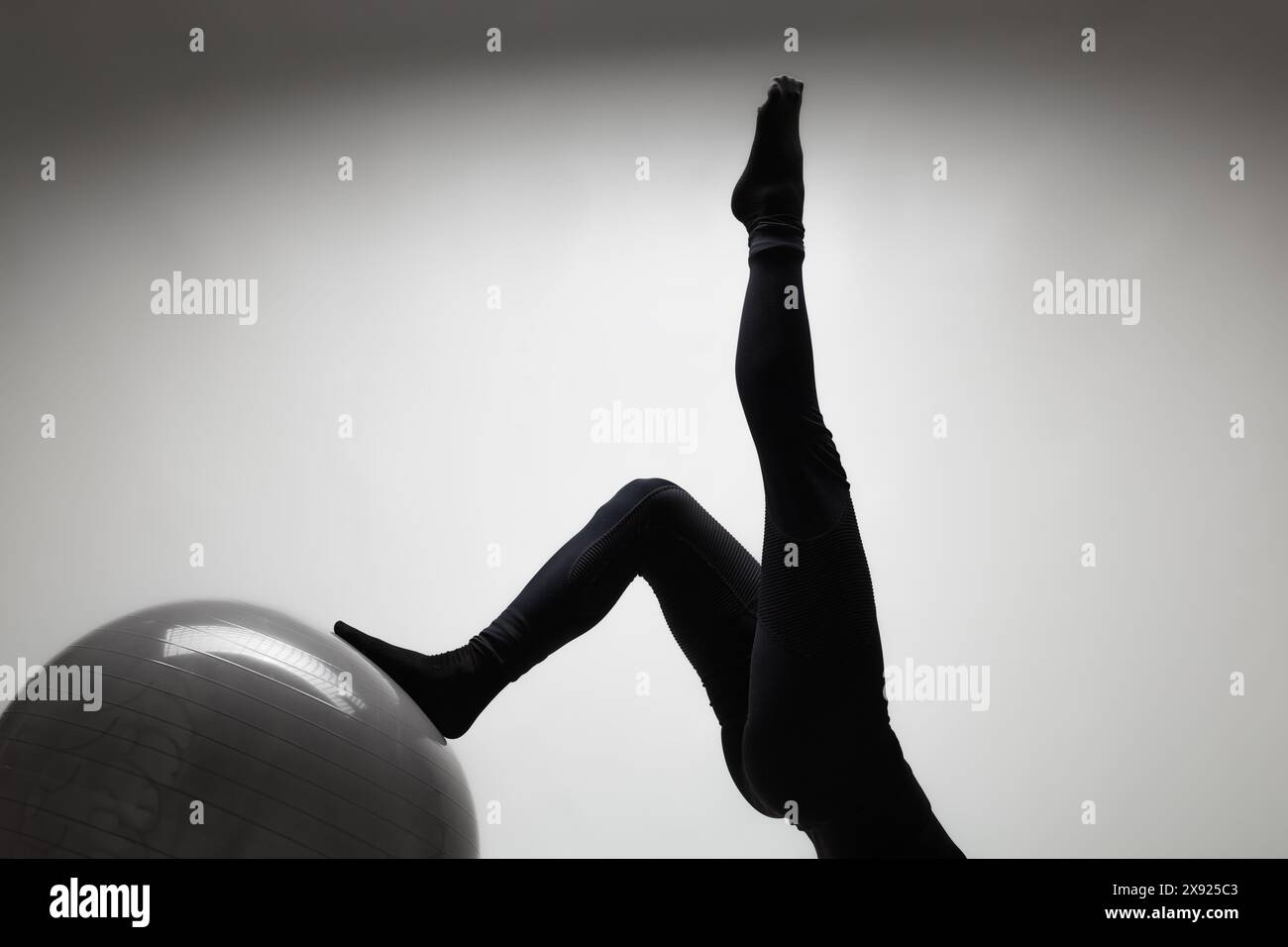 This striking image captures a young woman in silhouette, elegantly ...