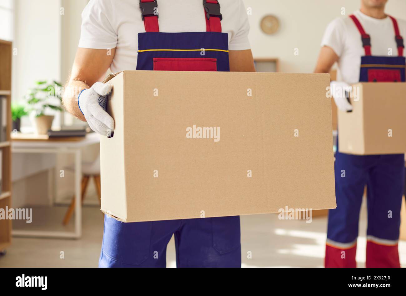 Mover man holding boxes hi-res stock photography and images - Alamy