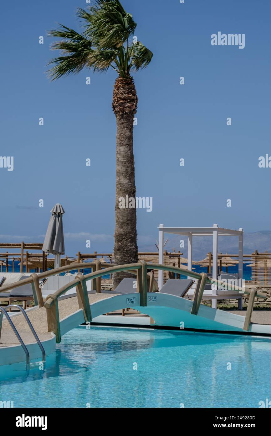 Ios, Greece - May 2, 2024 : View of a beautiful outdoor swimming pool ...