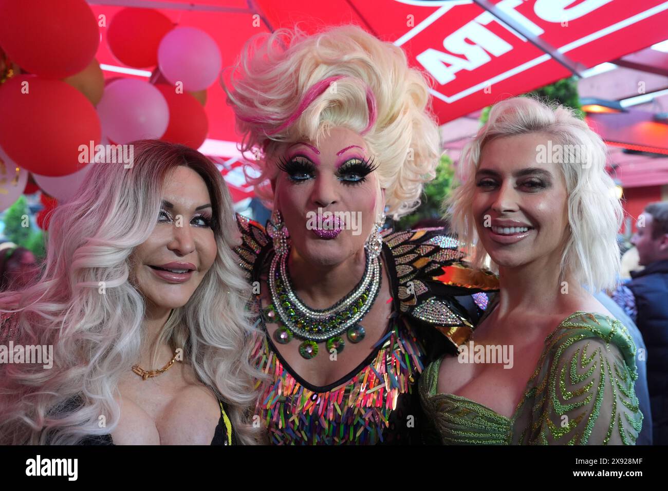 Hamburg, Germany. 28th May, 2024. Drag queen Olivia Jones (M), Dolly Buster (l) and Verena Kerth ...