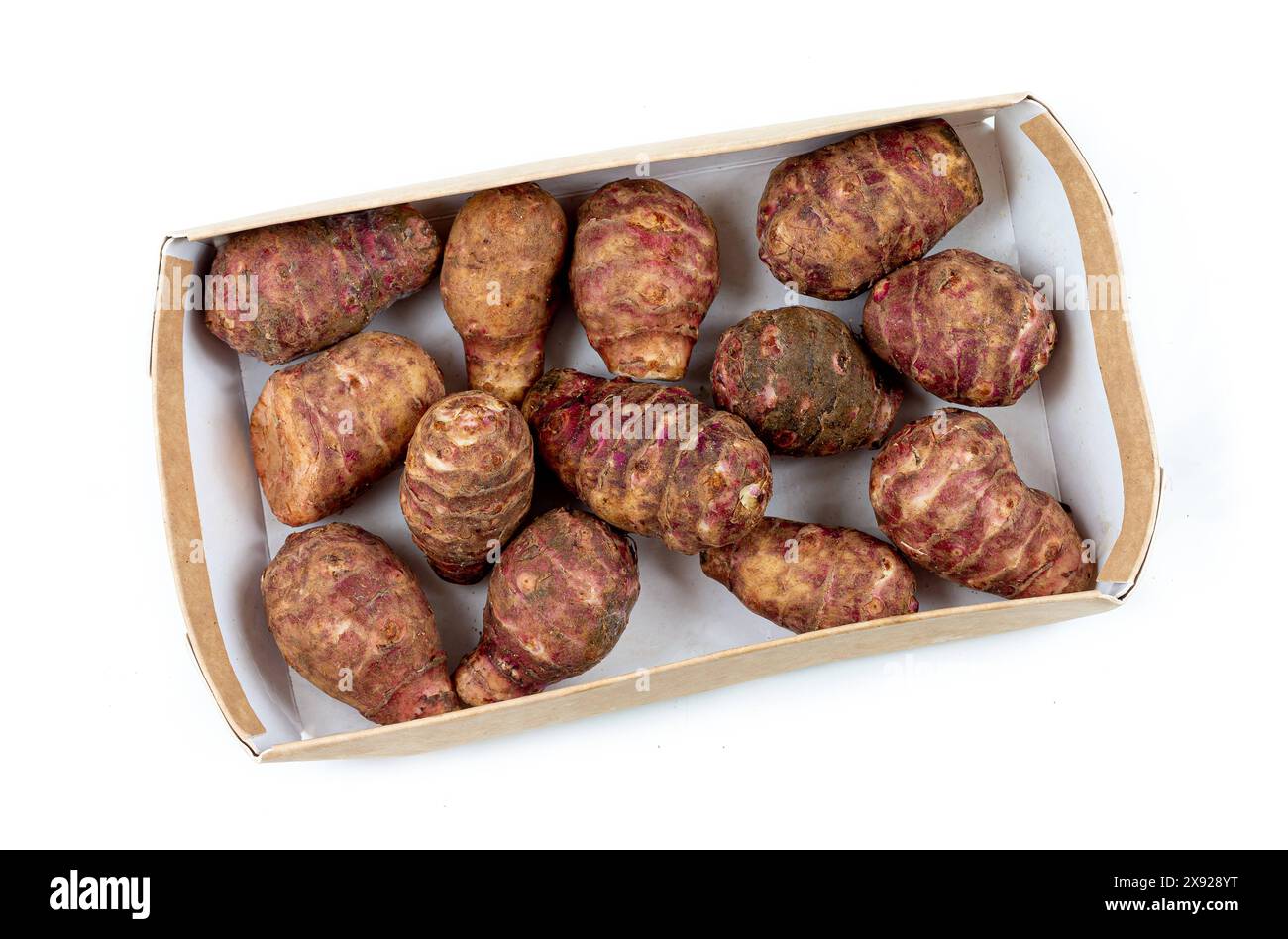 Jerusalem artichokes in a punnet - top view on a white background ...