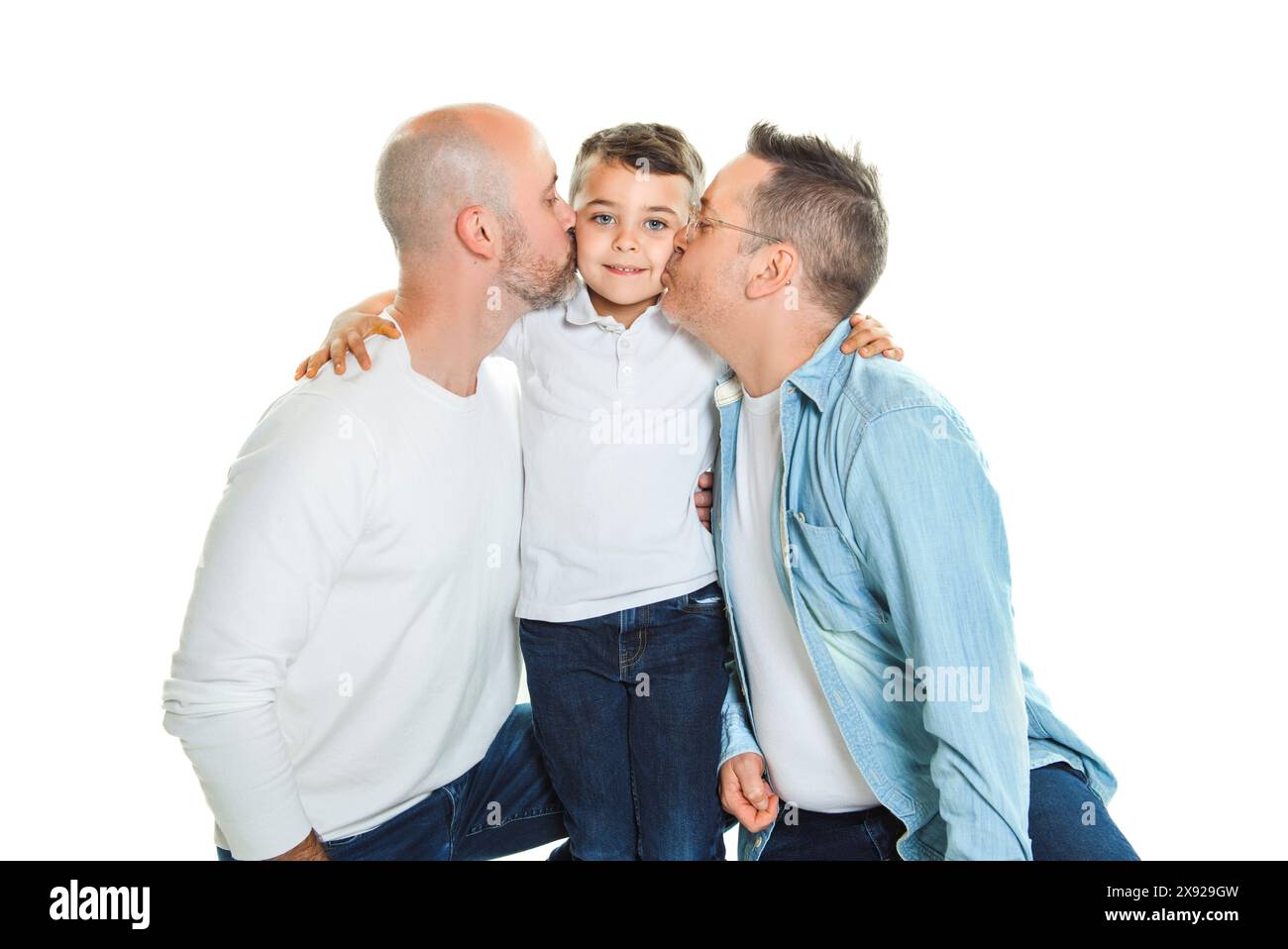 Two man couple with adopted child on white background Stock Photo - Alamy