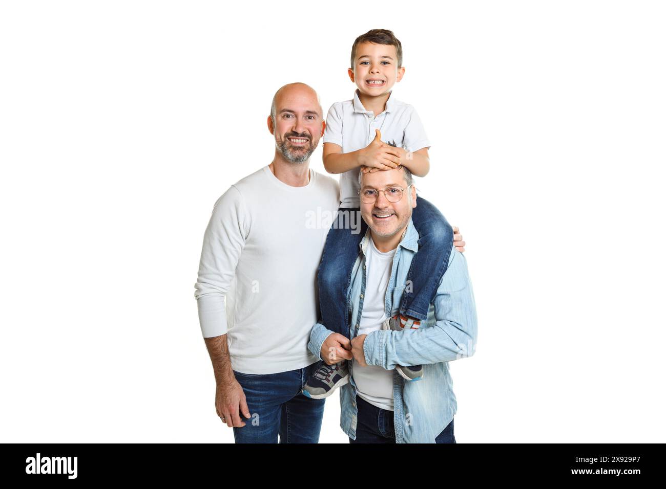 Two man couple with adopted child on white background Stock Photo - Alamy