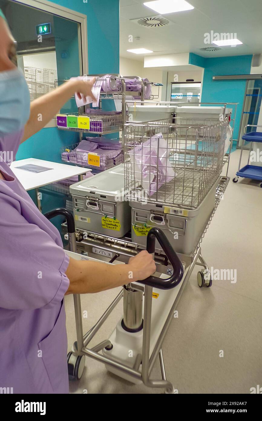 Operator carrying 2 sealed waterproof boxes of orthopedic surgery ...