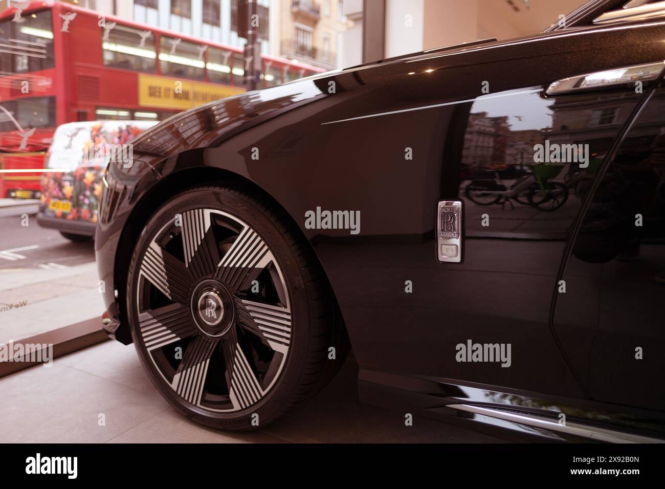 wheel of British black luxury limousine Rolls-Royce Phantom VIII with ...